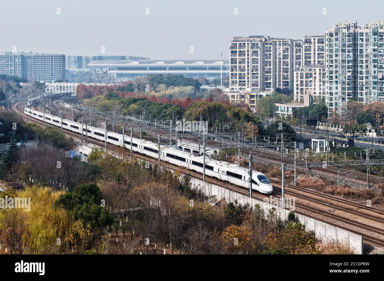 A high-speed train runs on a high-speed rail line in the main urban ...