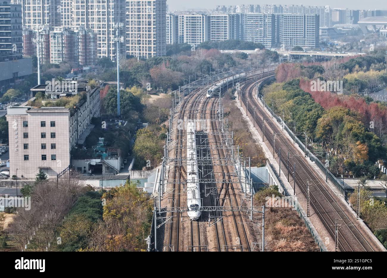 A high-speed train runs on a high-speed rail line in the main urban ...