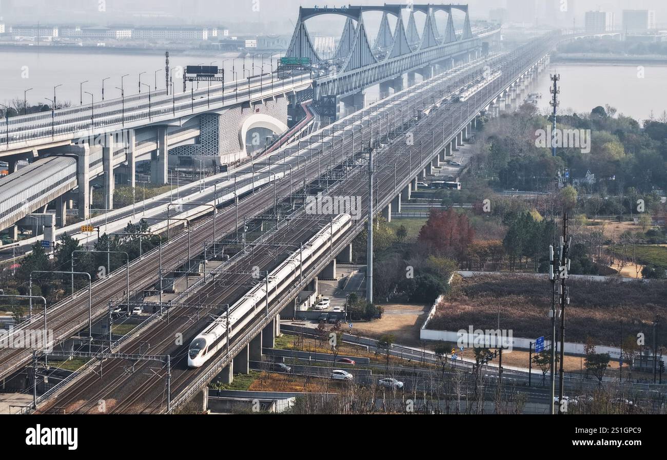 A high-speed train runs on a high-speed rail line in the main urban ...