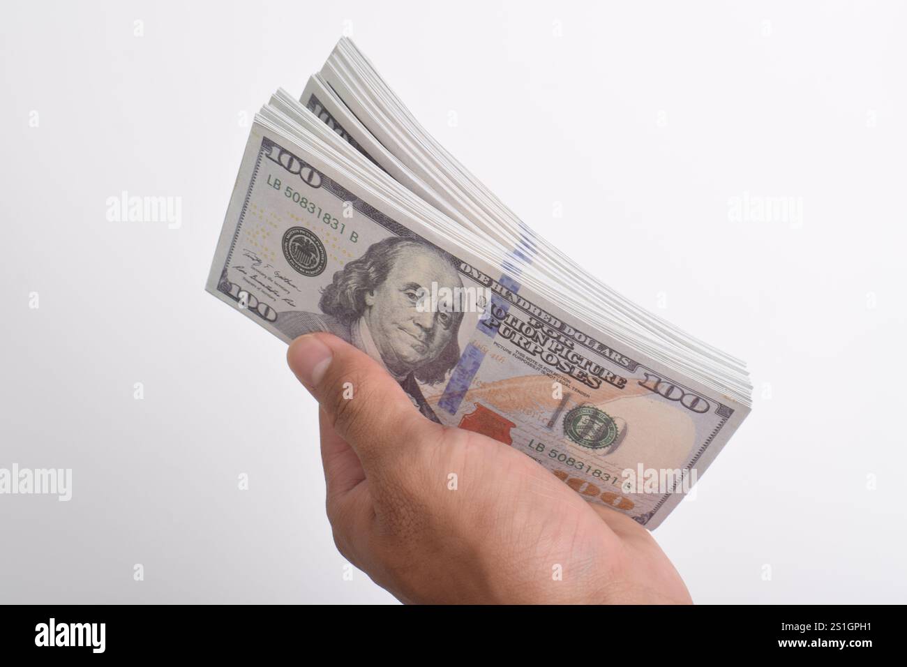 Man hand reaching out dollar bill. Hand holding dollar bill, US $100 ...