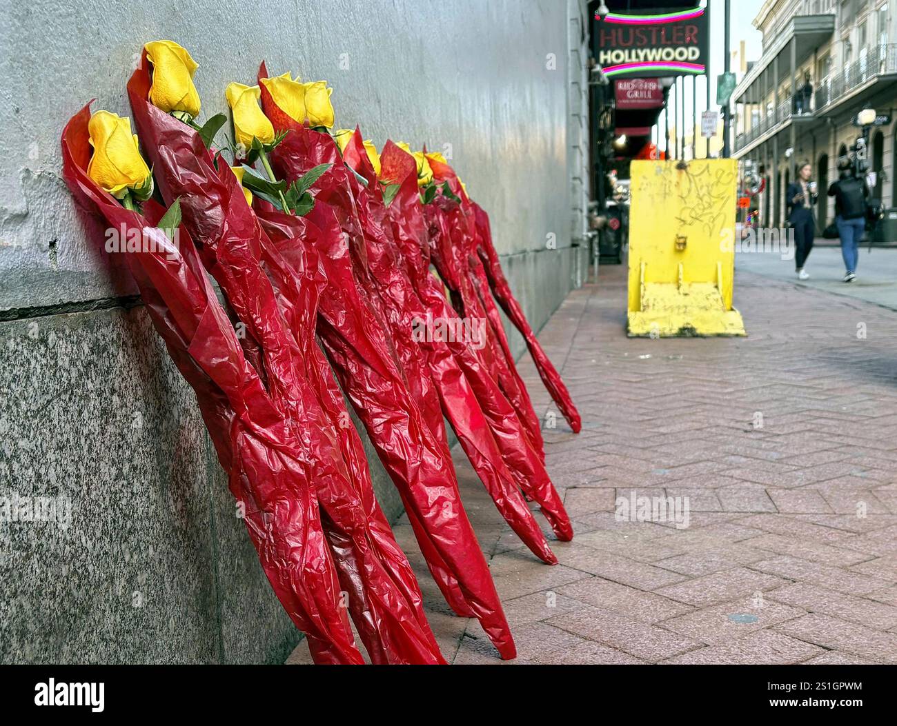 Fourteen flowers are offered at the terror site on Bourbon Street after ...
