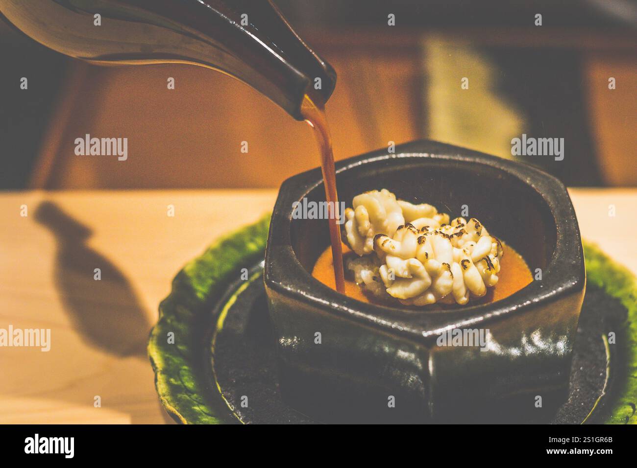 Cod Milt and Donabe Rice in japanese curry bisque soup Stock Photo - Alamy