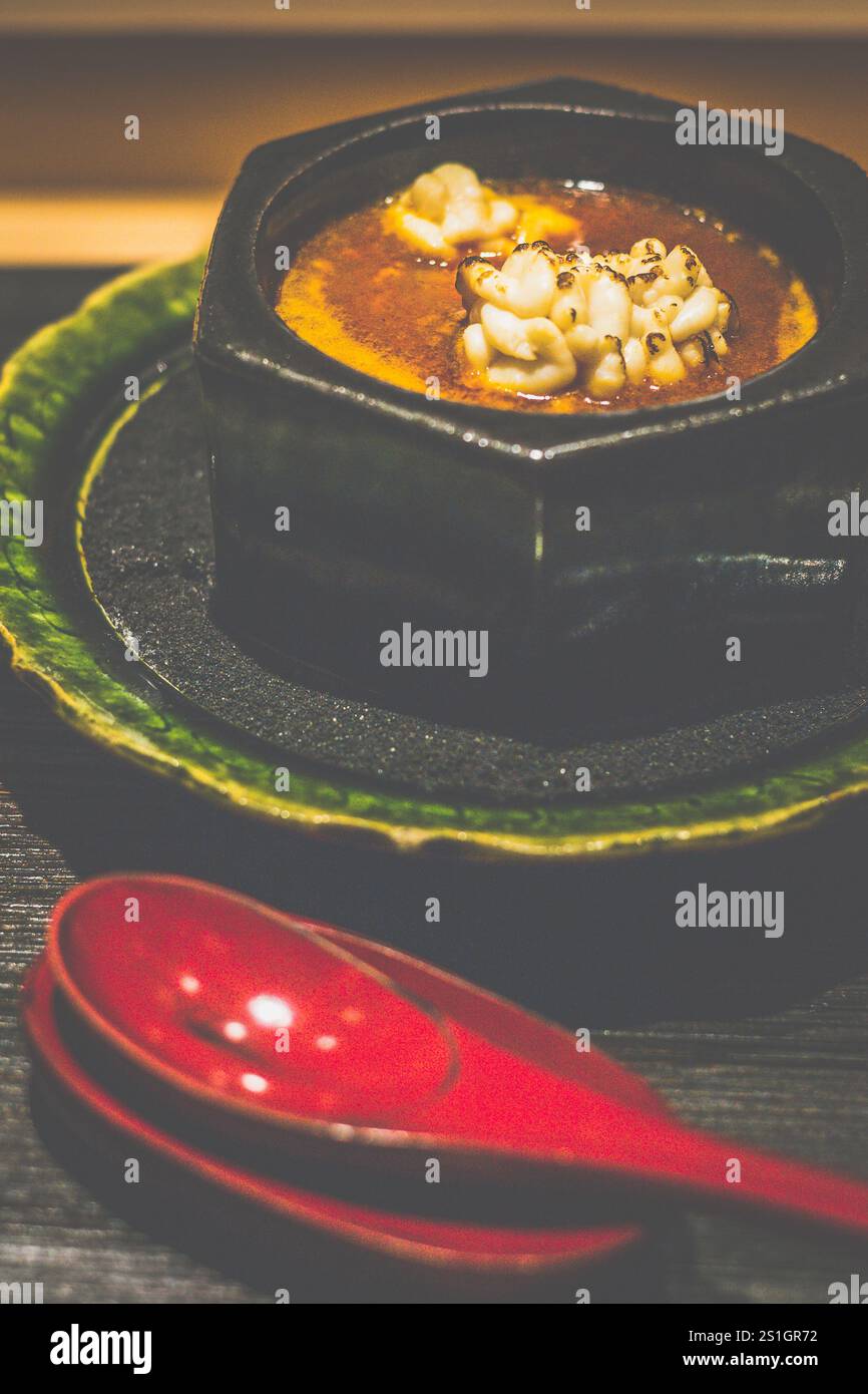 Cod Milt and Donabe Rice in japanese curry bisque soup Stock Photo - Alamy