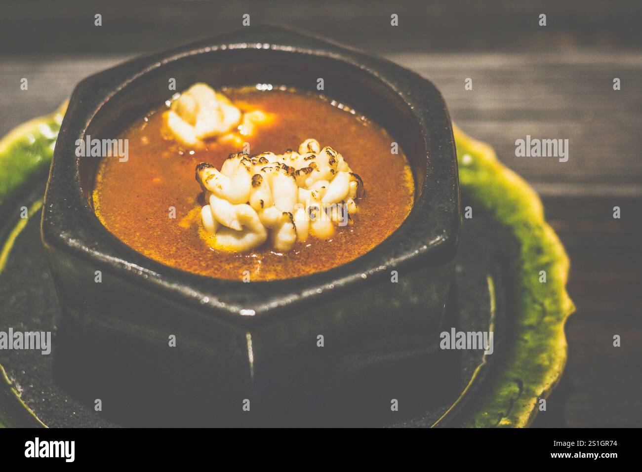 Cod Milt and Donabe Rice in japanese curry bisque soup Stock Photo - Alamy