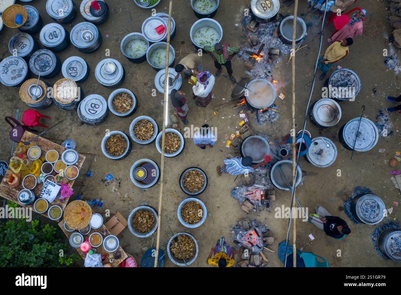An aerial view captures an extensive cooking setup for a wedding ...