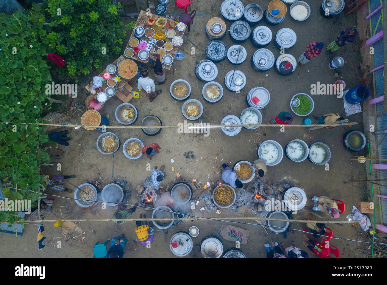 An aerial view captures an extensive cooking setup for a wedding ...