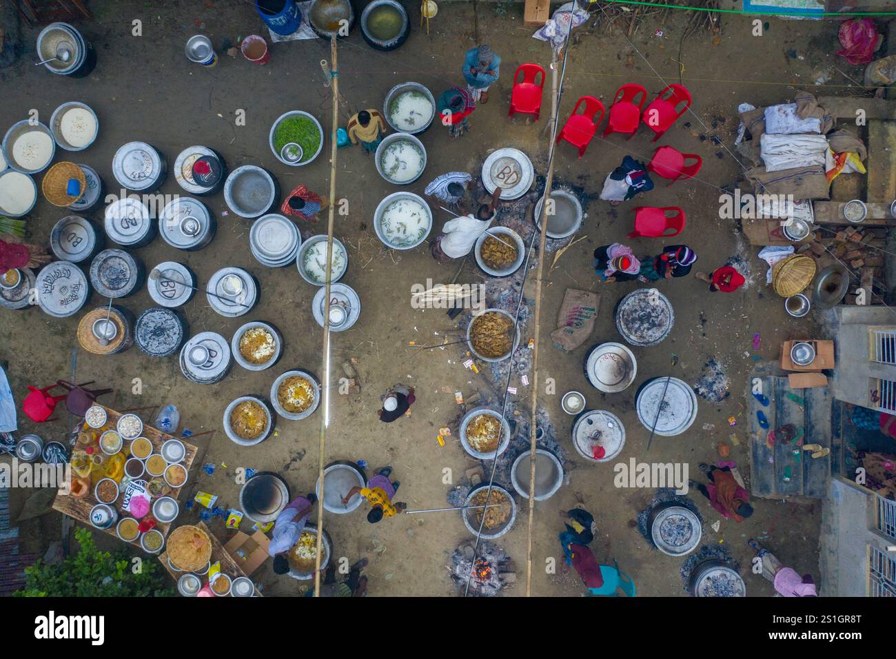 An aerial view captures an extensive cooking setup for a wedding ...
