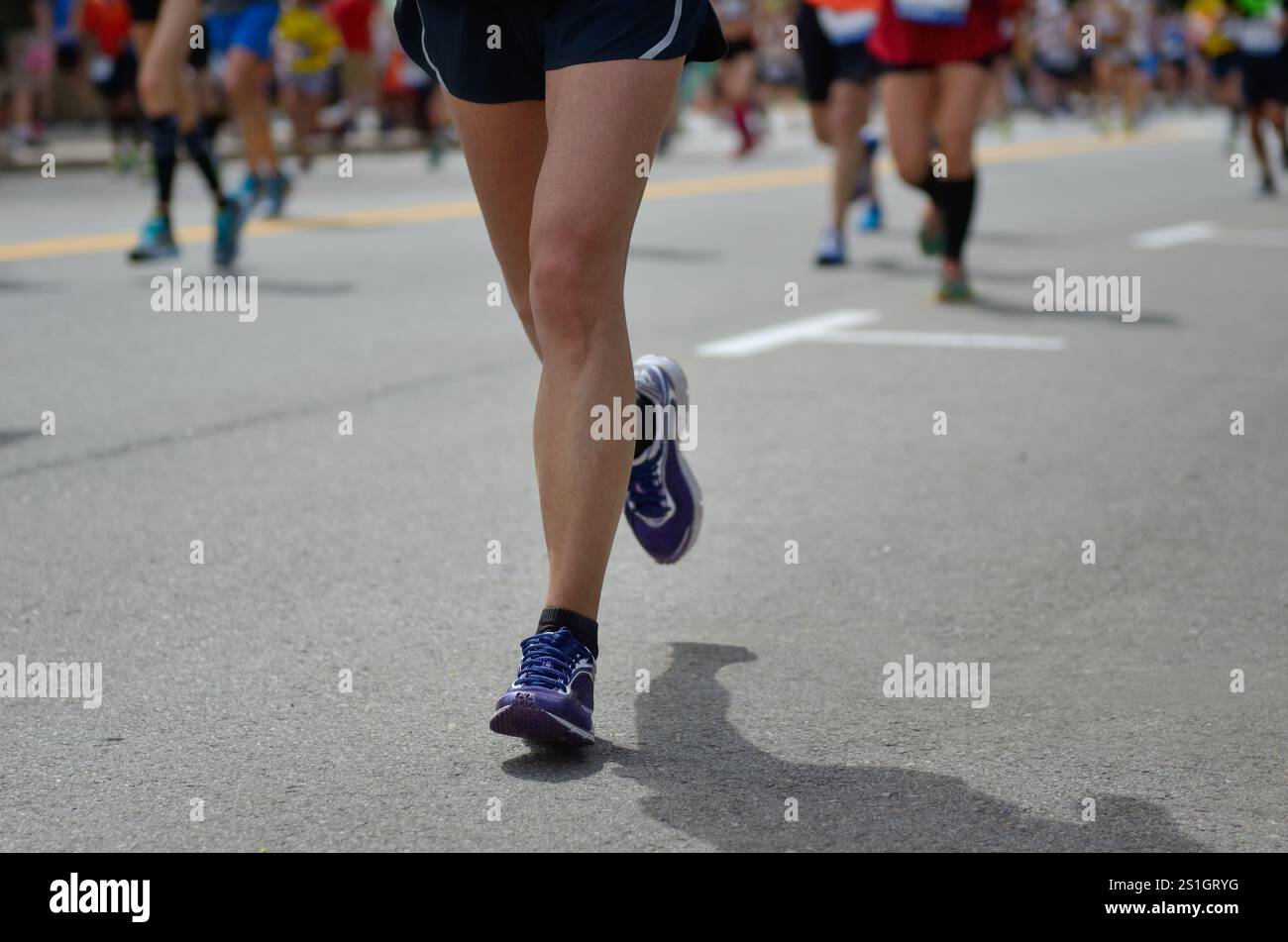 Marathon running race, many runners feet on road, sport, fitness and ...