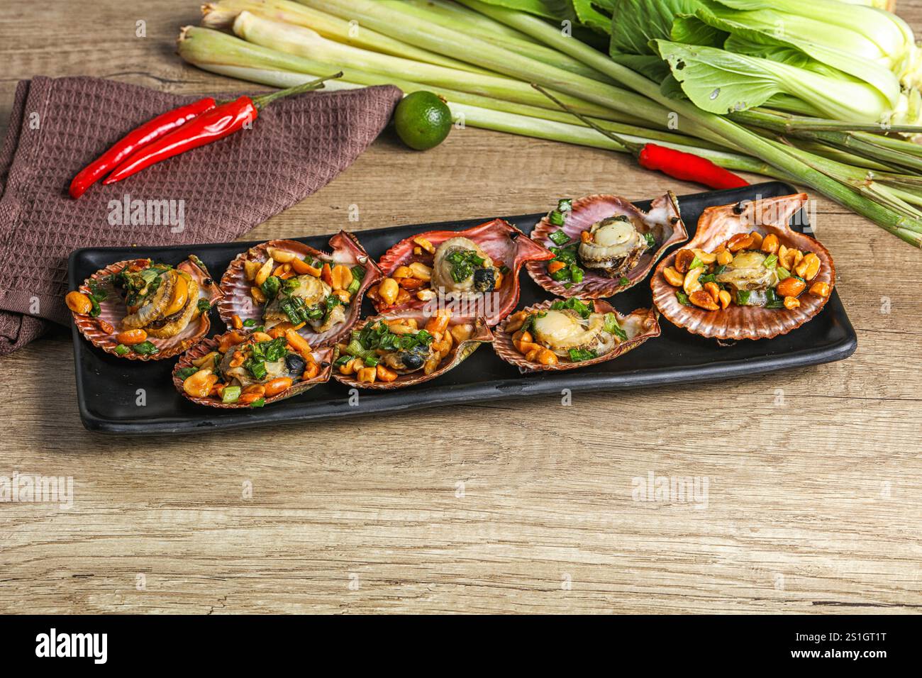 Baked scallops with scalion oil and green onion Stock Photo - Alamy