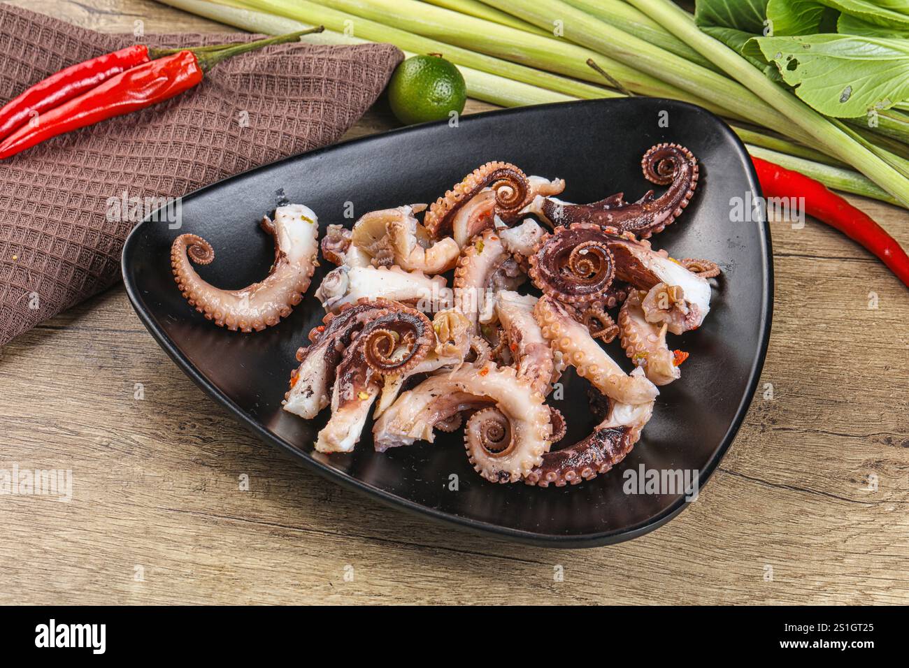 Grilled octopus red tentacle sliced appetizer Stock Photo - Alamy