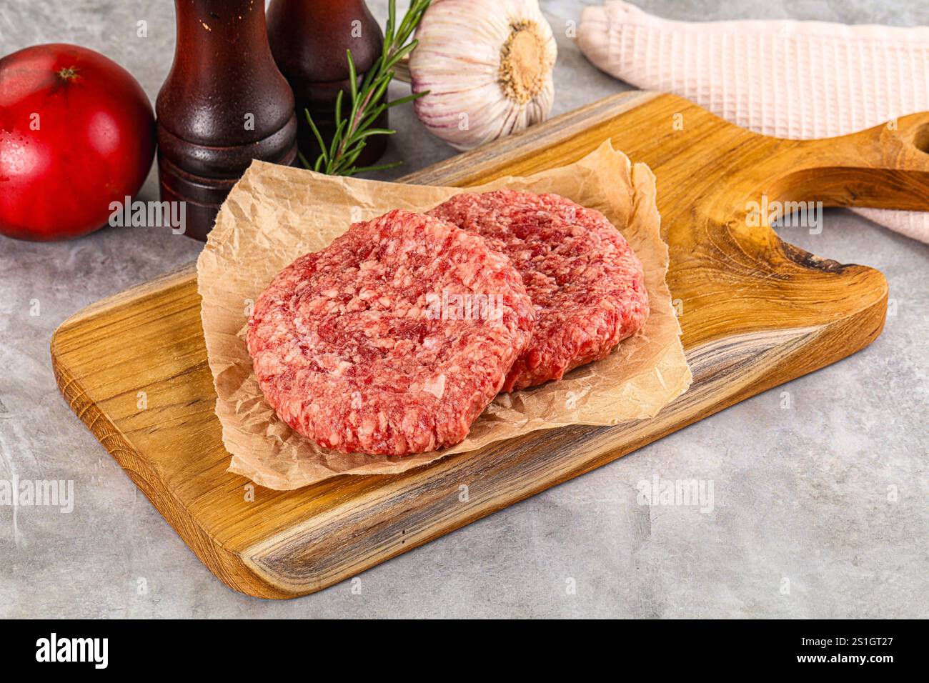 Raw round uncooked beef cutlet minced meat Stock Photo - Alamy