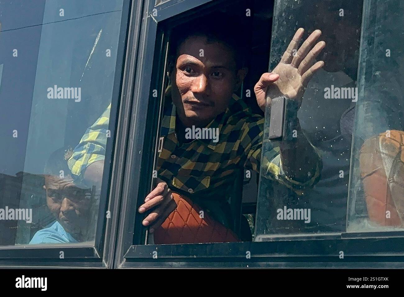 Released prisoners, in a bus, are welcomed by family members and ...