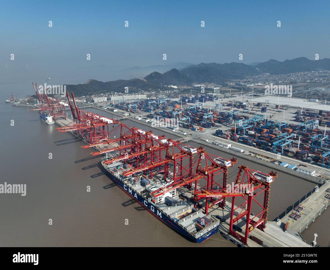 NINGBO, CHINA - JANAURY 4, 2025 - Cargo ships load and unload ...