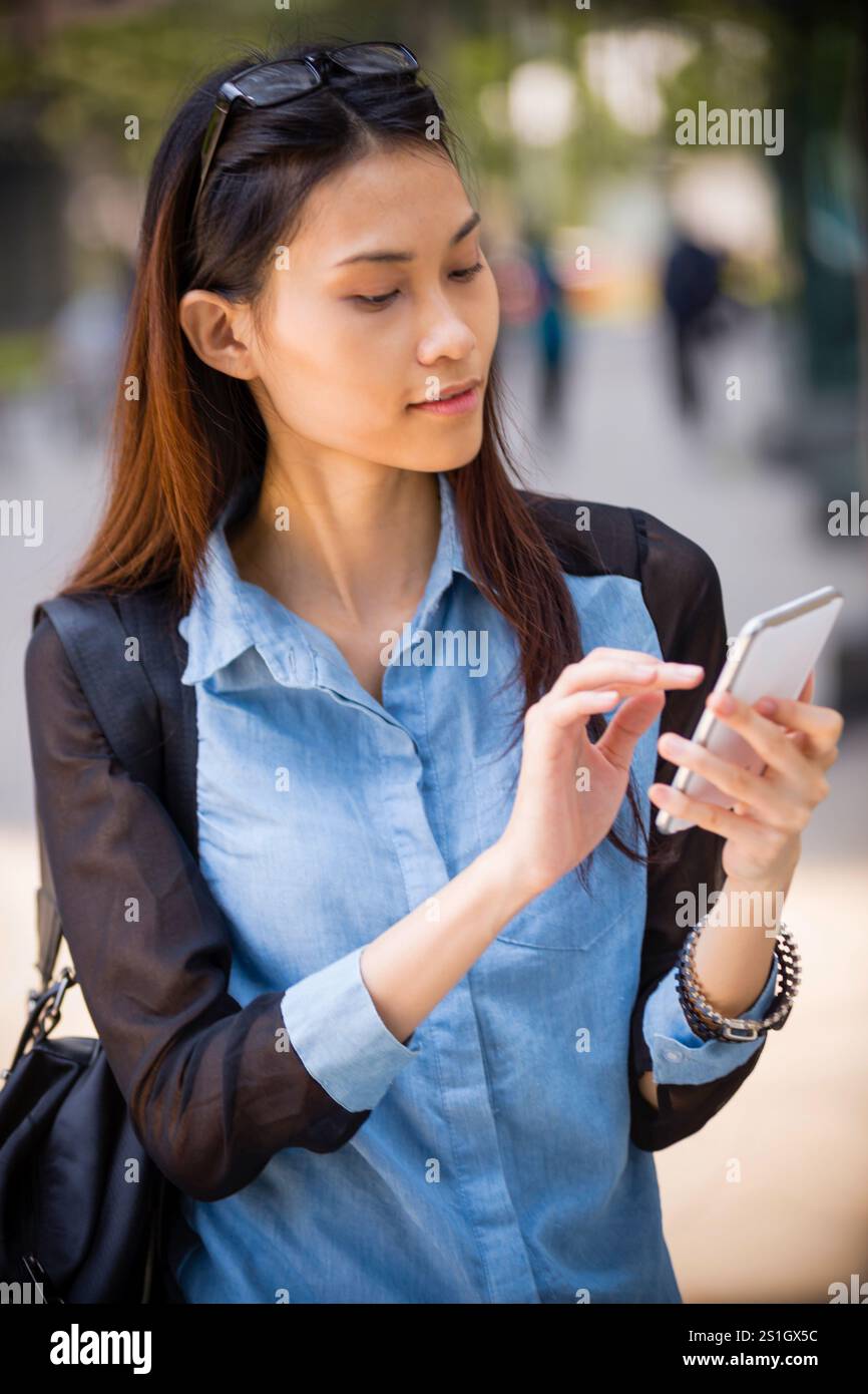 A young beautiful adult Thai Malaysian Chinese woman wearing eye ...