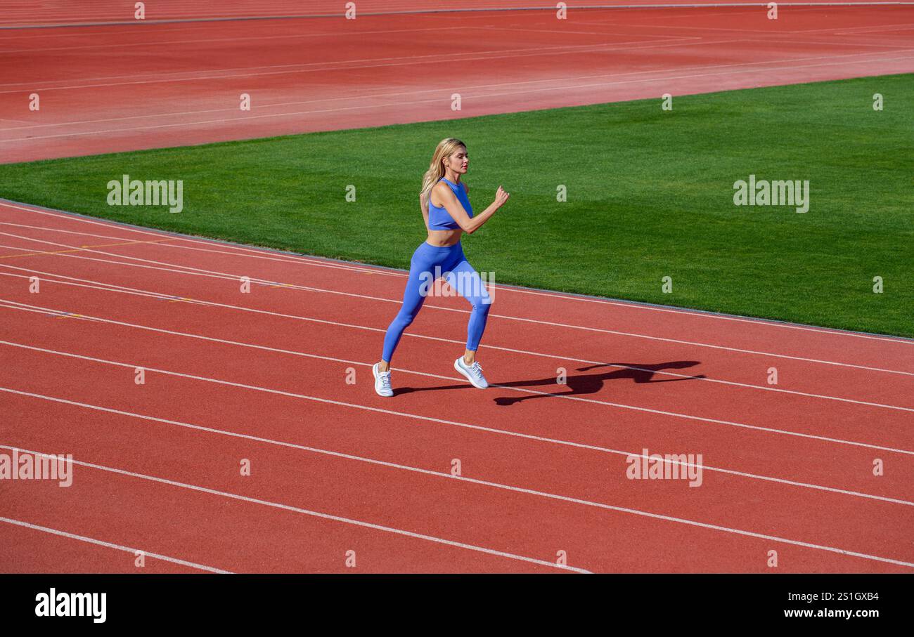 Fitness woman on stadium, run. Young fitness woman runner running on ...