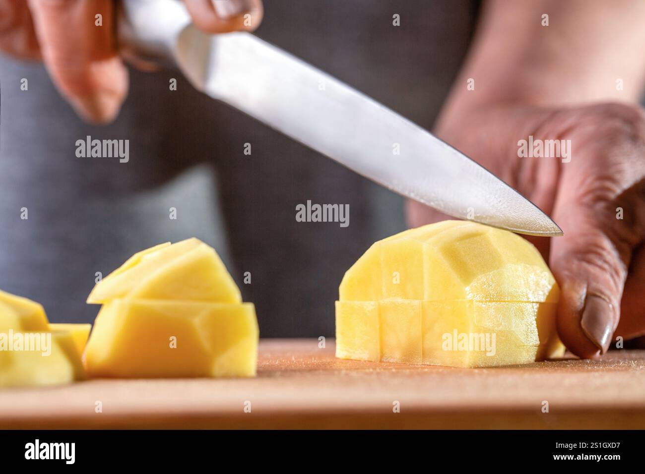 Man cuts potato on cutting hi-res stock photography and images - Alamy