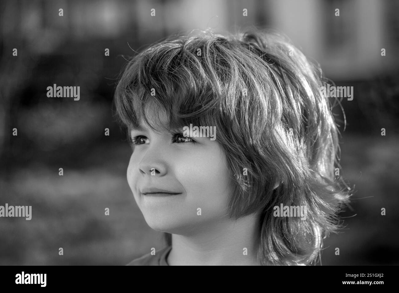 Little boy walks on outdoors. Cute little boy portrait closeup. Blonde ...