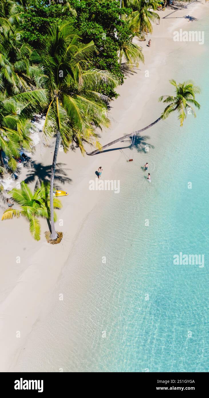 Sunlight dances on the soft sandy shoreline of Koh Kood, where visitors ...