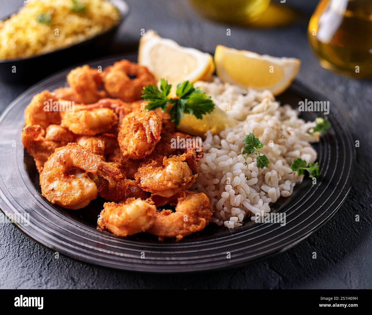 A vibrant seafood platter showcases perfectly fried calamari and juicy ...