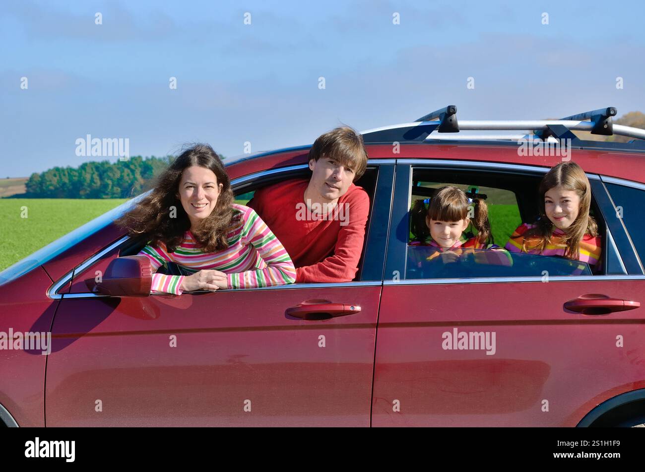 Family car travel on vacation, happy parents and kids have fun in ...