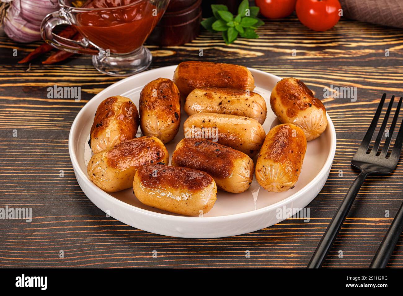 Roasted chicken mini sausages for breakfast in the bowl Stock Photo - Alamy