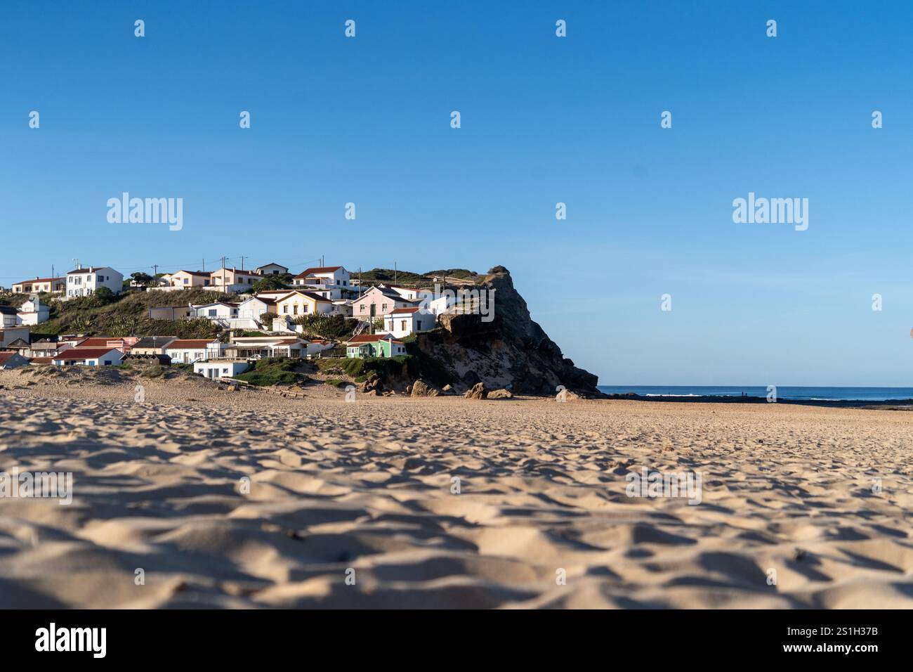 Beatiful view of Monte Clerigo beach and its colourful, traditional ...