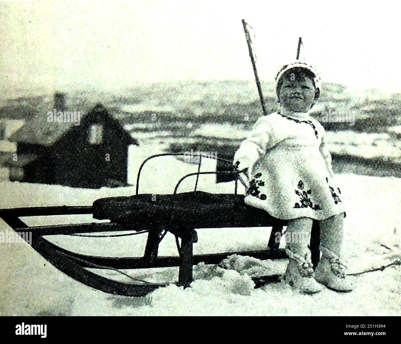 A 1940 snapshot of a Norwegian child in traditional clothing sitting on ...