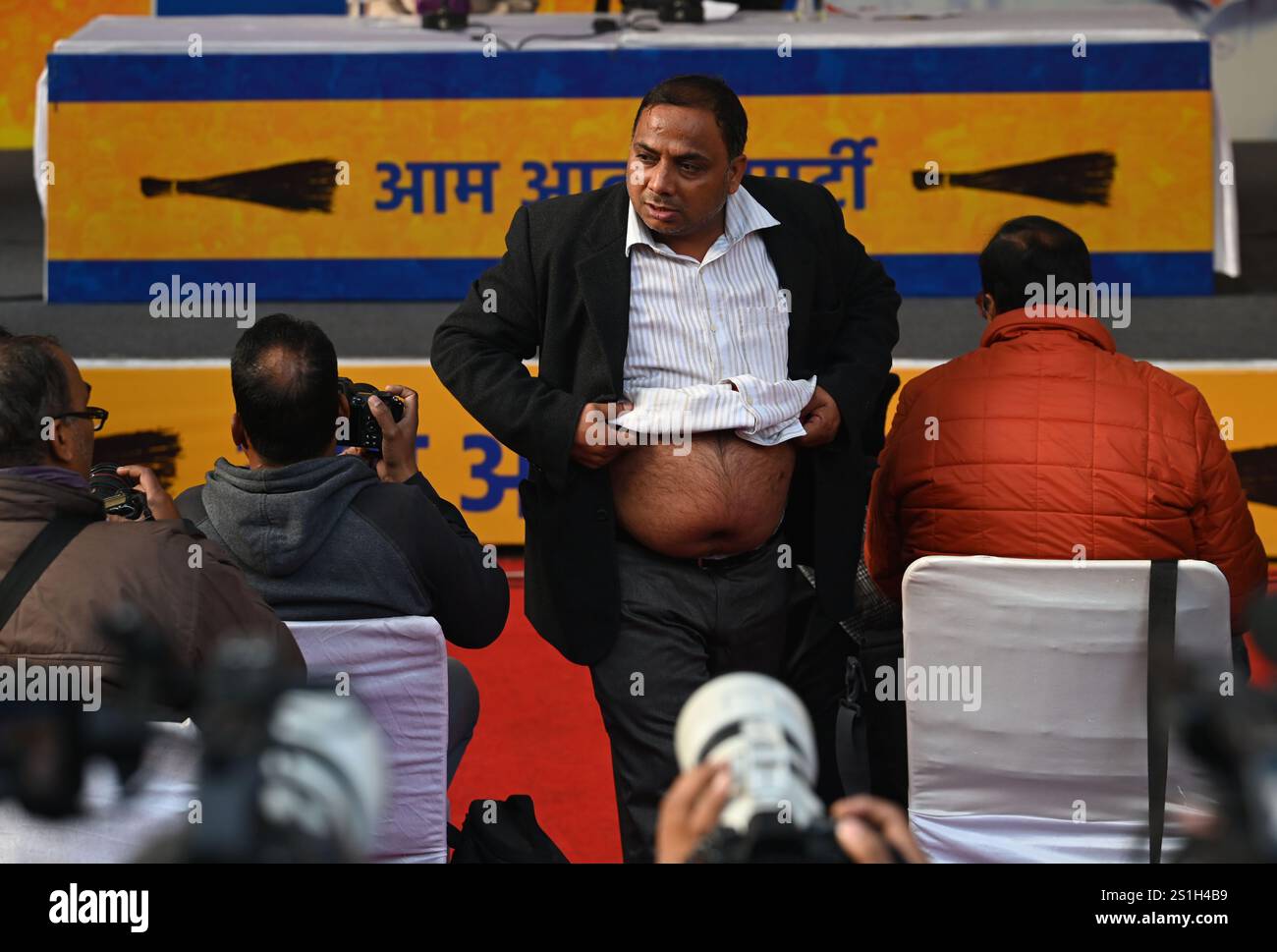 NEW DELHI, INDIA - JANUARY 3: A showing man showing his belly asking ...