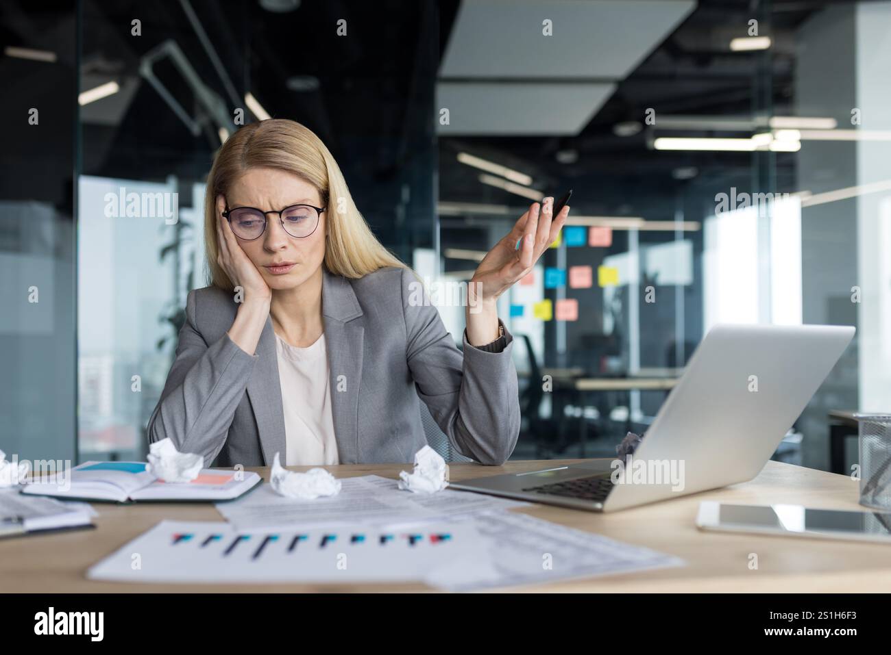 Disappointed and upset woman at workplace, businesswoman financier ...