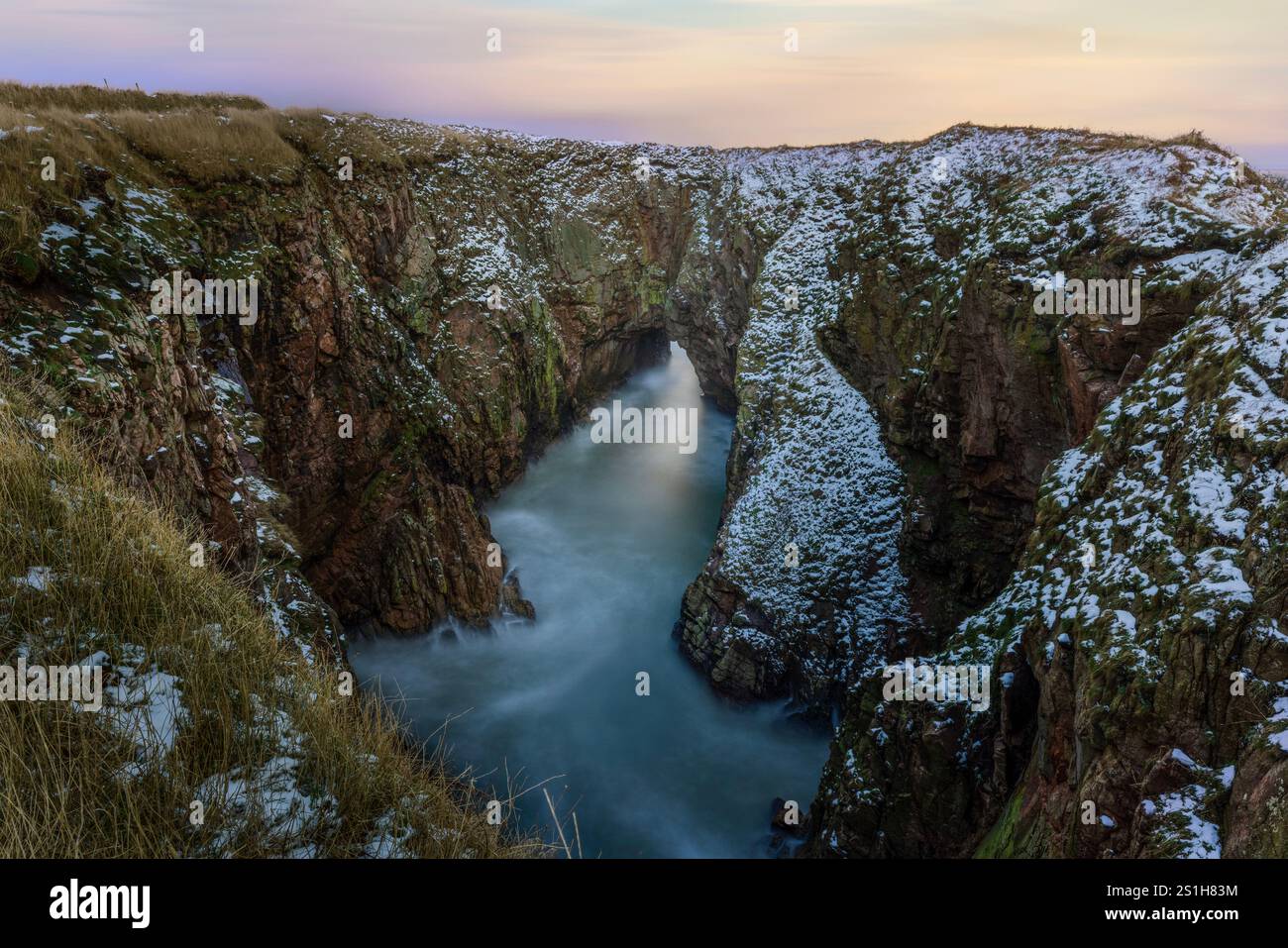 The rugged coast of Bullers of Buchan is located south of Peterhead in ...