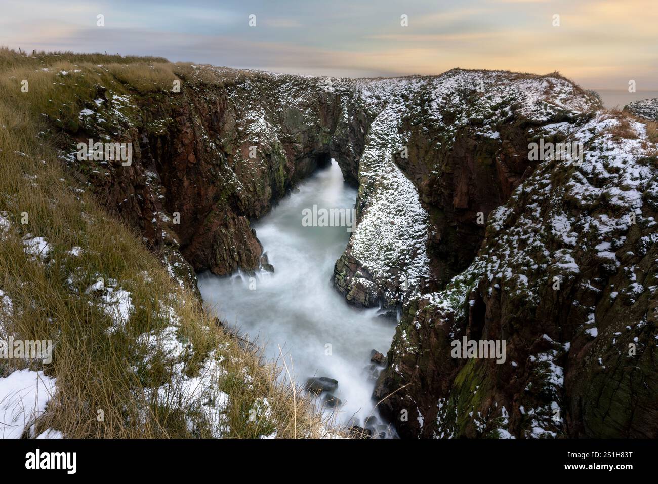 The rugged coast of Bullers of Buchan is located south of Peterhead in ...