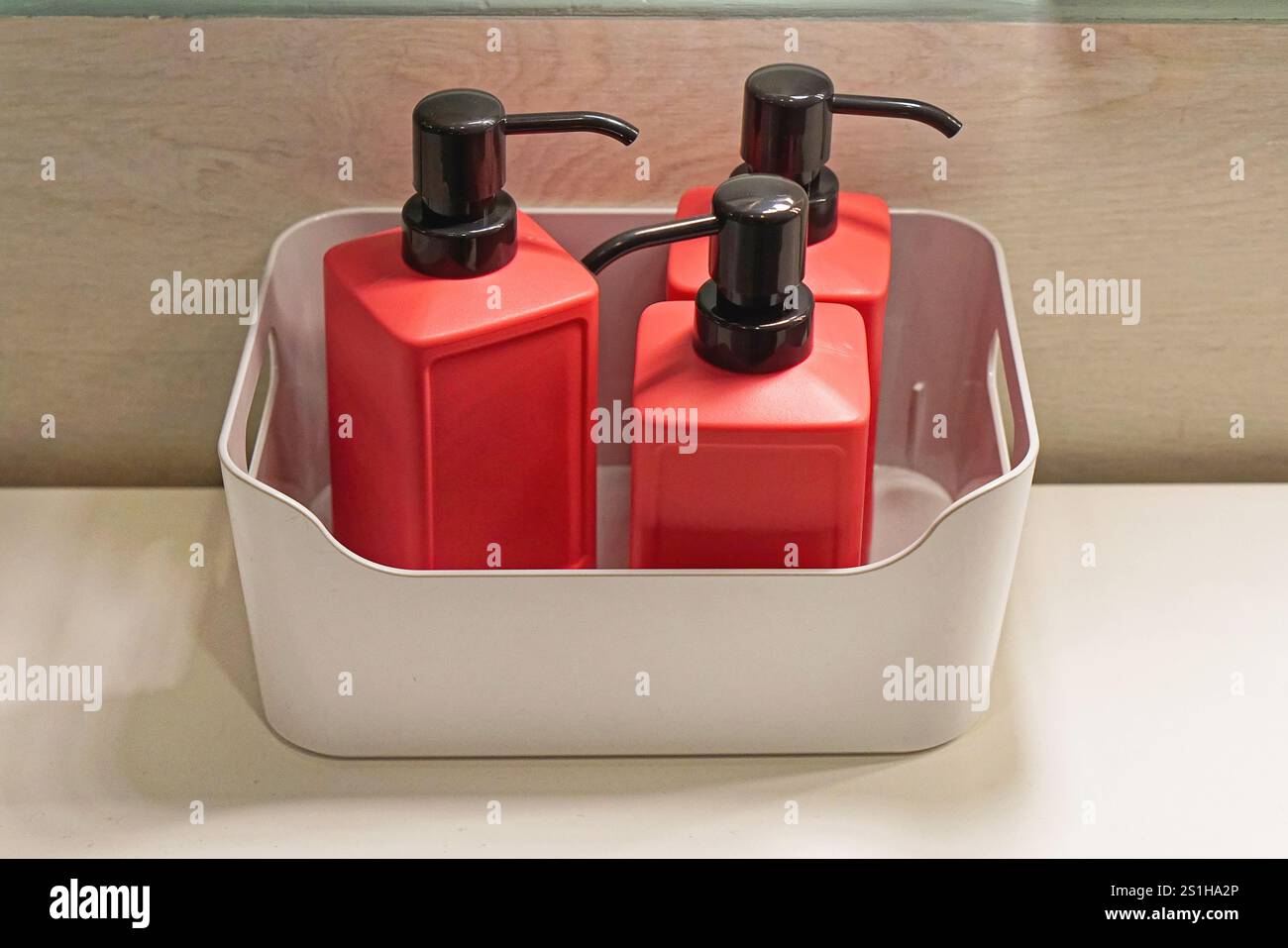 Three modern soap dispensers in tub bathroom equipment Stock Photo - Alamy