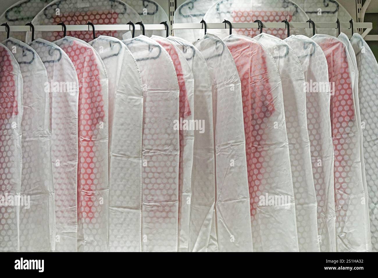 Hanging garment clothing covers dust protection in wardrobe closet ...