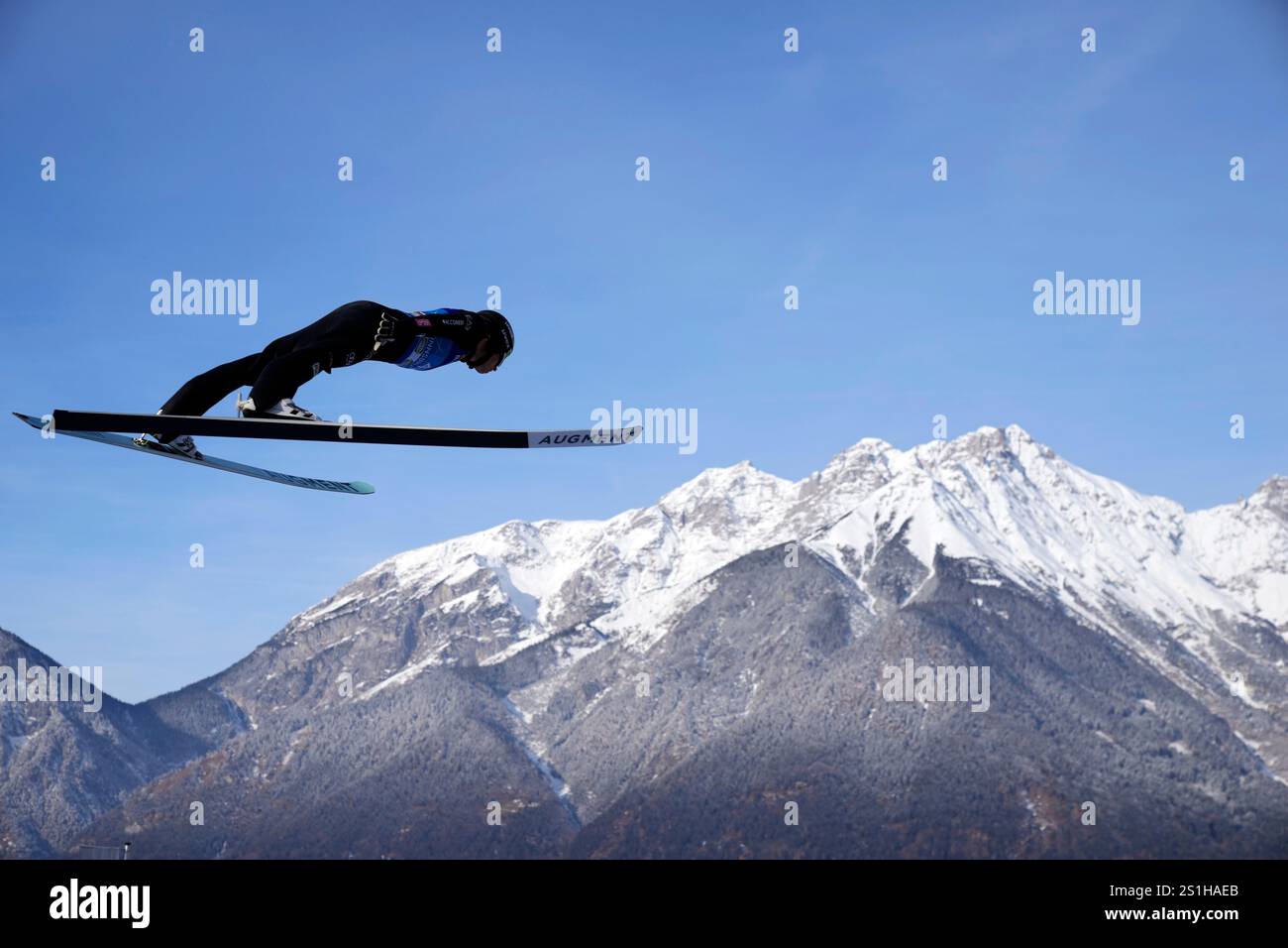 Alex Insam, of Italy, soars through the air during his trial jump at ...