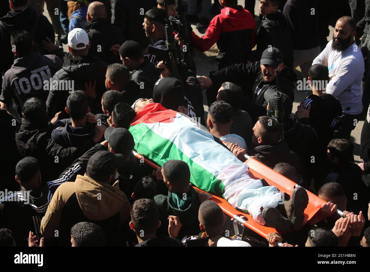 People attend the funeral of 18 years old Mohamad Amir who was shot ...