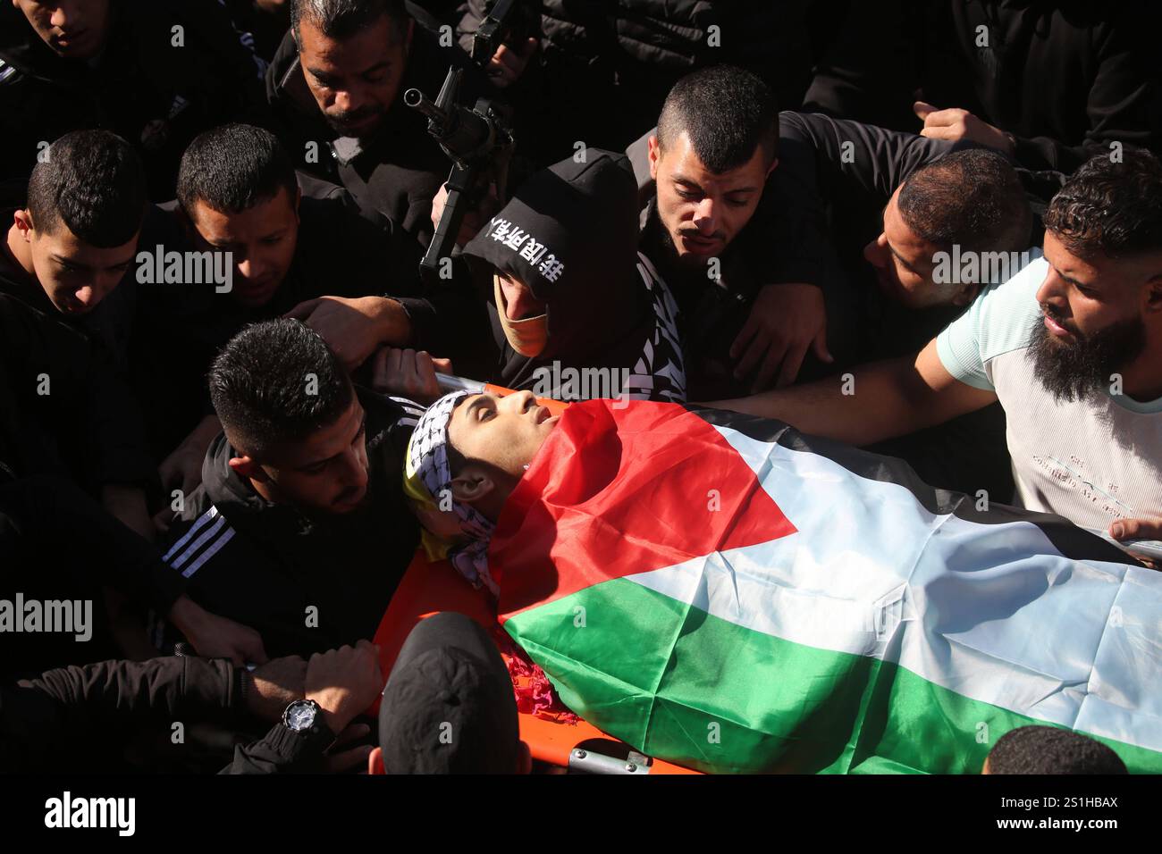People attend the funeral of 18 years old Mohamad Amir who was shot ...