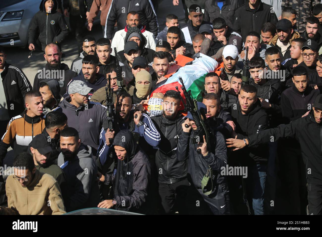 People attend the funeral of 18 years old Mohamad Amir who was shot ...