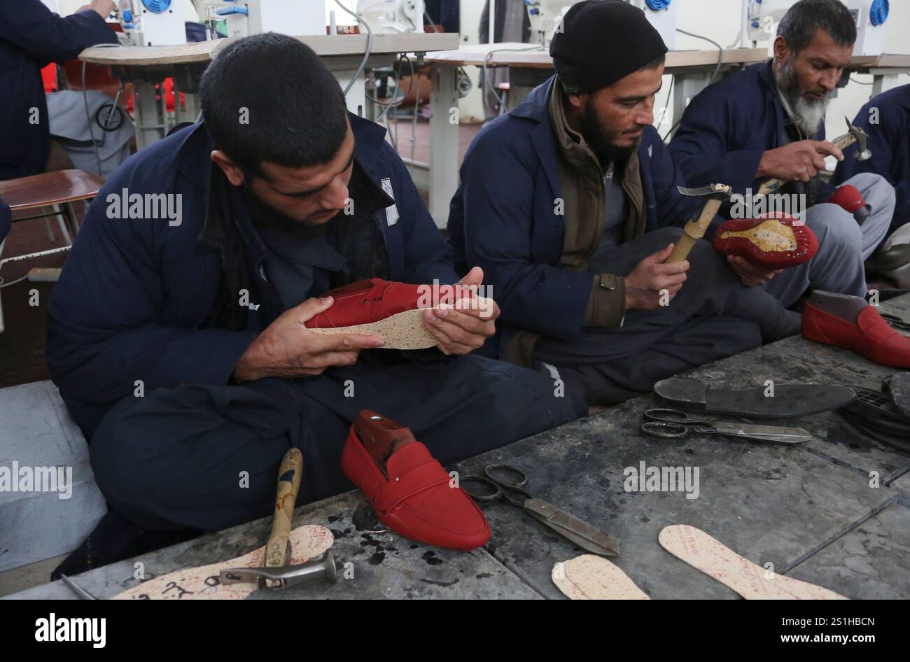Kabul, Afghanistan. 4th Jan, 2024. Recovered drug addicts make shoes at ...