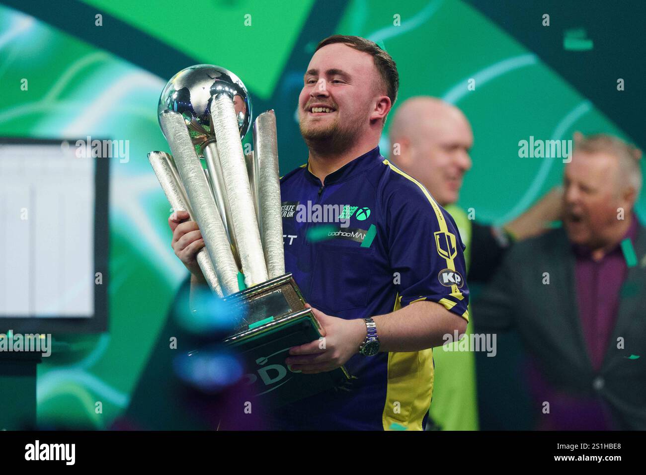 Luke Littler lifting the Paddy Power World Darts Championship trophy ...