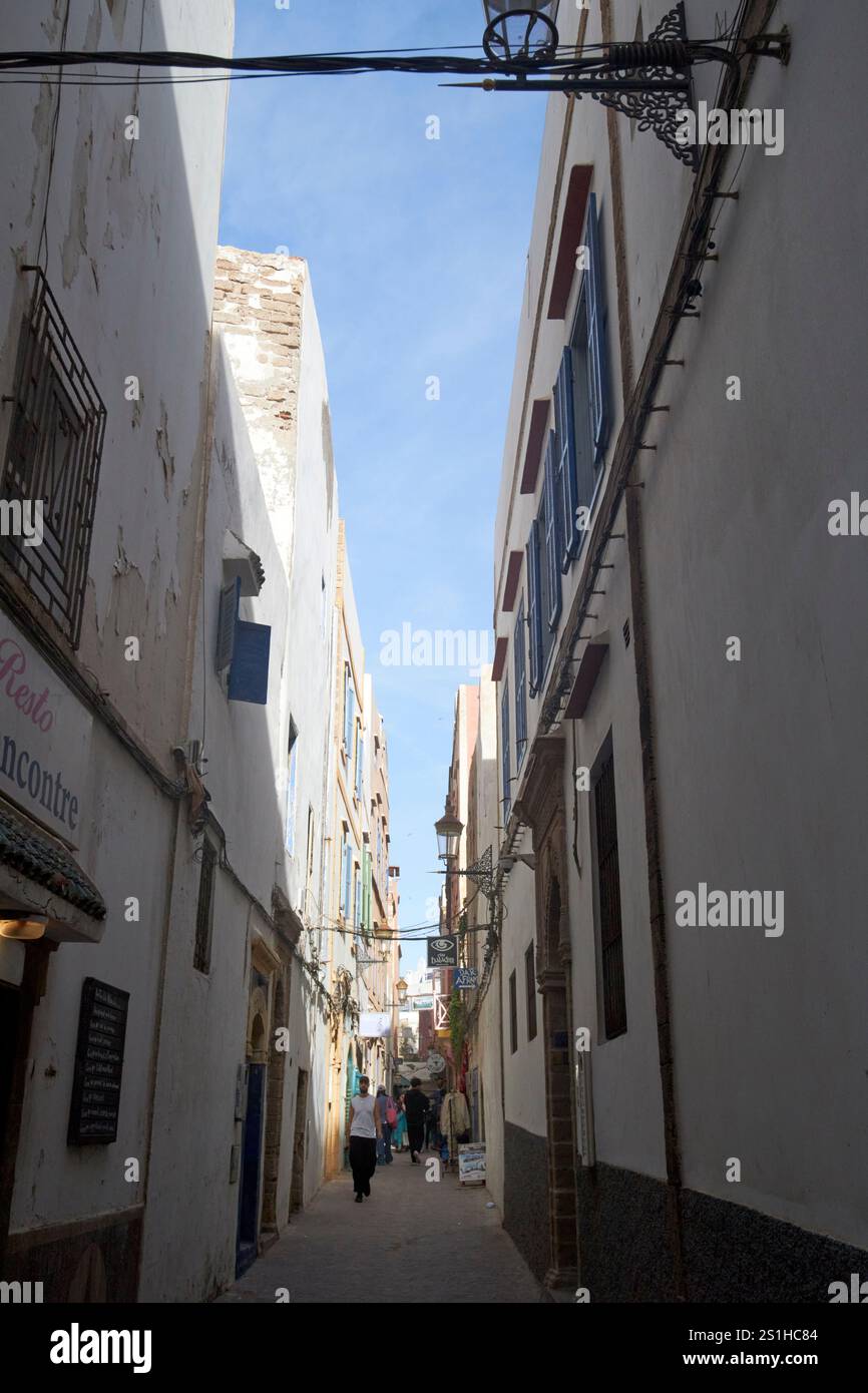 tall narrow white painted streets of the medina old city unesco world ...