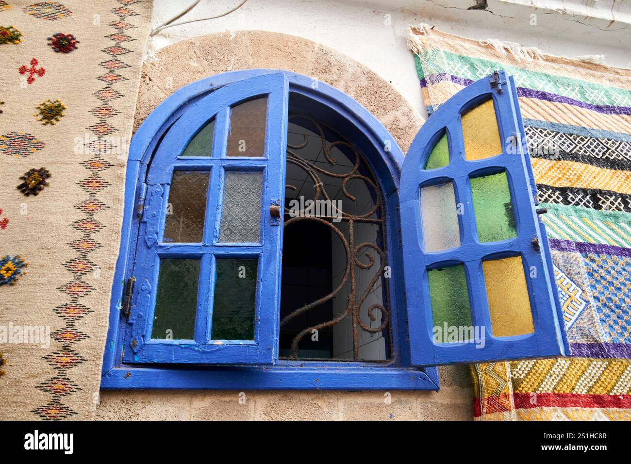 plue painted wooden coloured glass window in the medina old city unesco ...