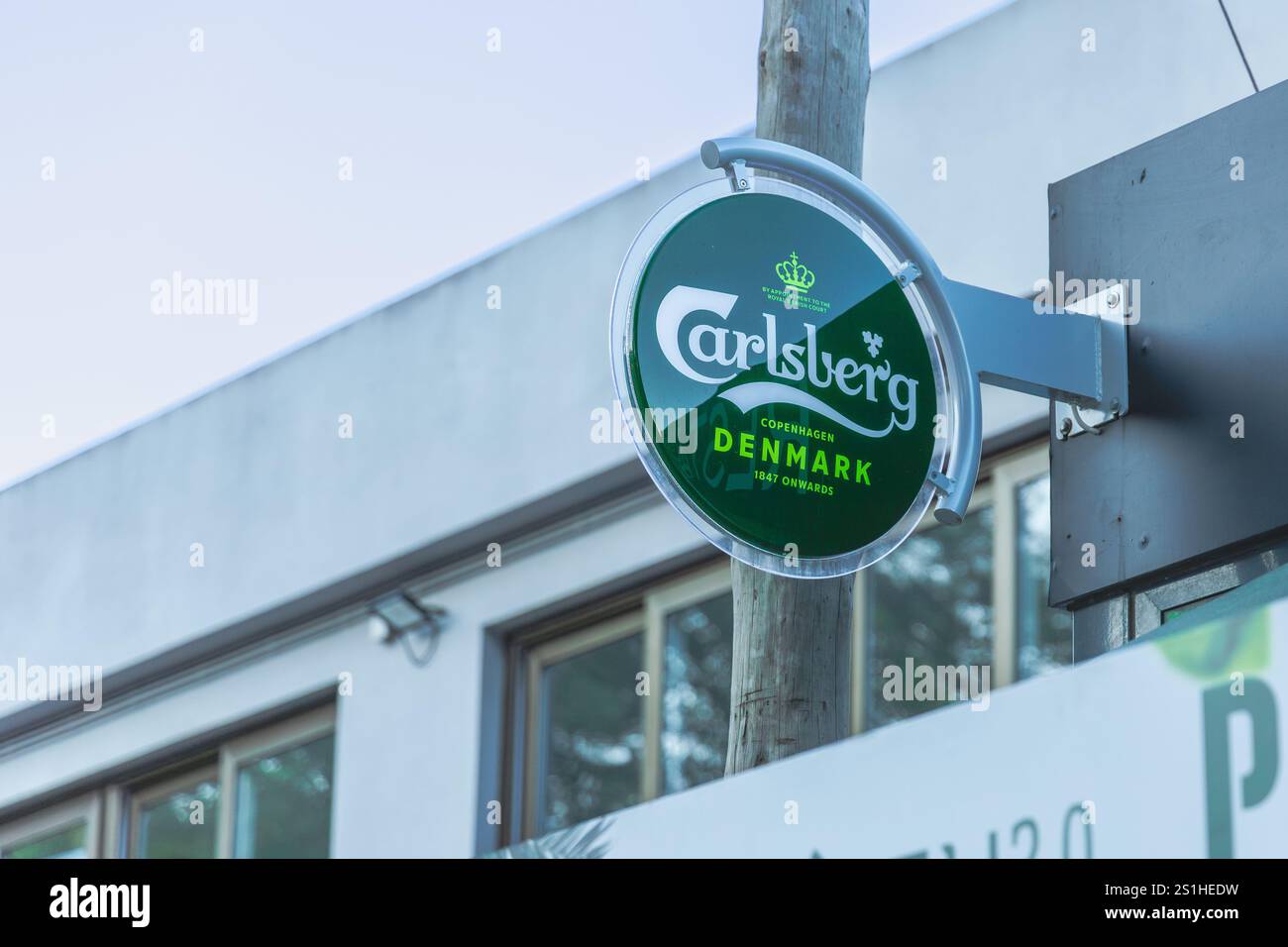 Lisbon, Portugal, 16 August 2024. Carlsberg logo sign at a bar. The ...
