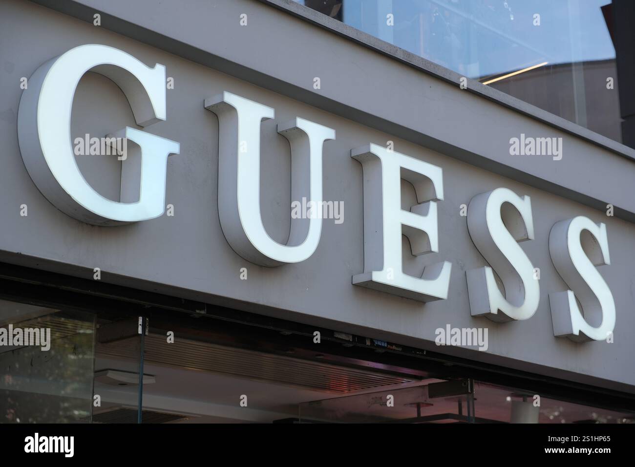 Guess brand logo store sign Stock Photo - Alamy