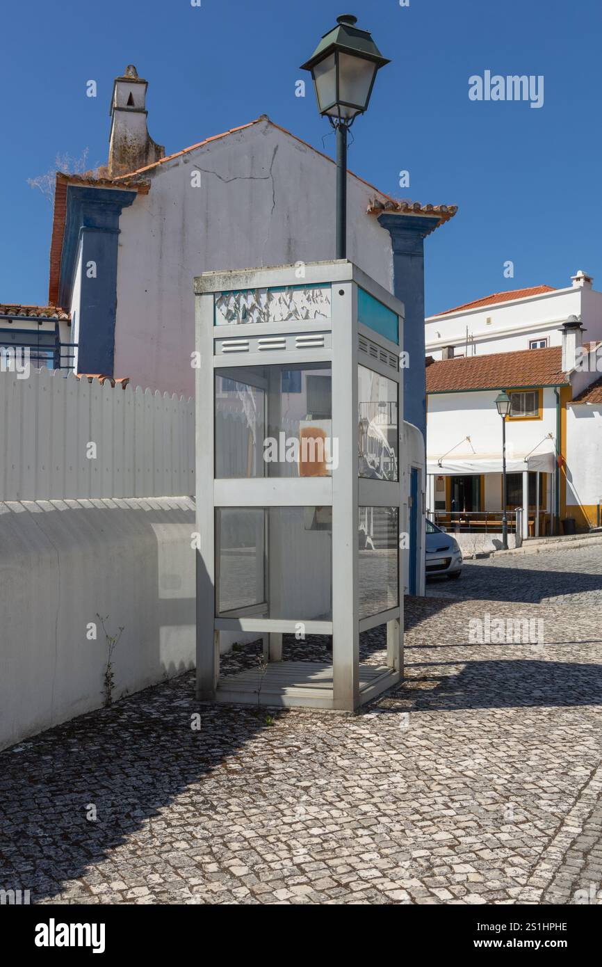 An old-fashioned phone booth on the street in a village in Portugal ...