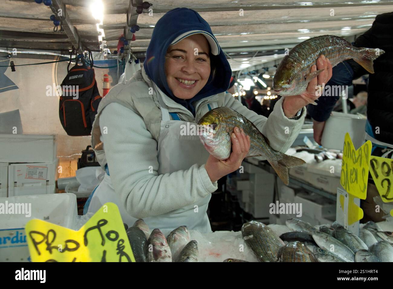 Fishmonger showing her wares hi-res stock photography and images - Alamy