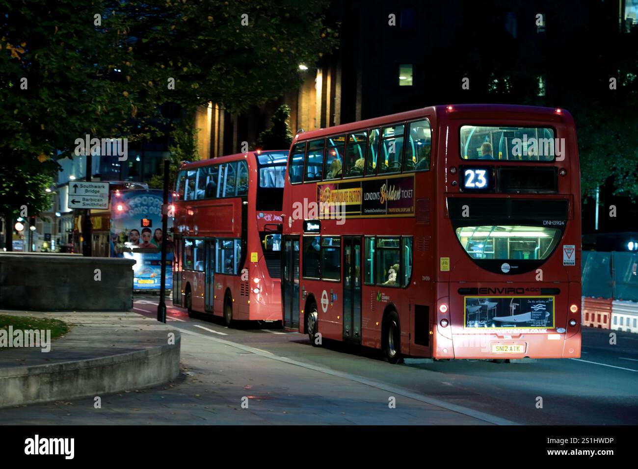 London Night Bus Scene, A vibrant night-time photograph capturing ...
