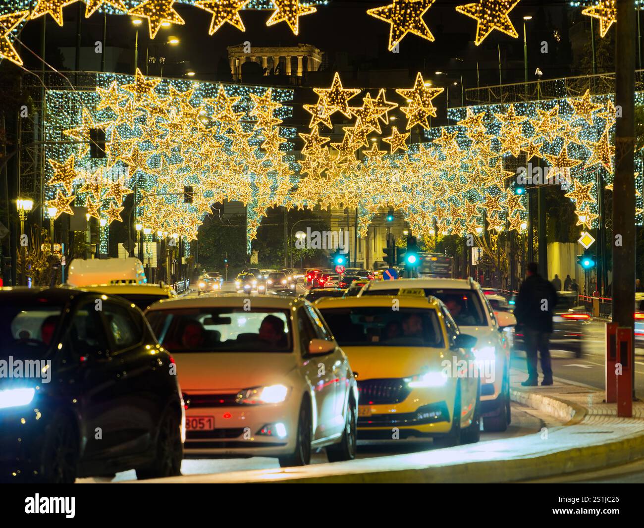 Athens, Greece - January 3, 2025: Urban street at night with traffic ...