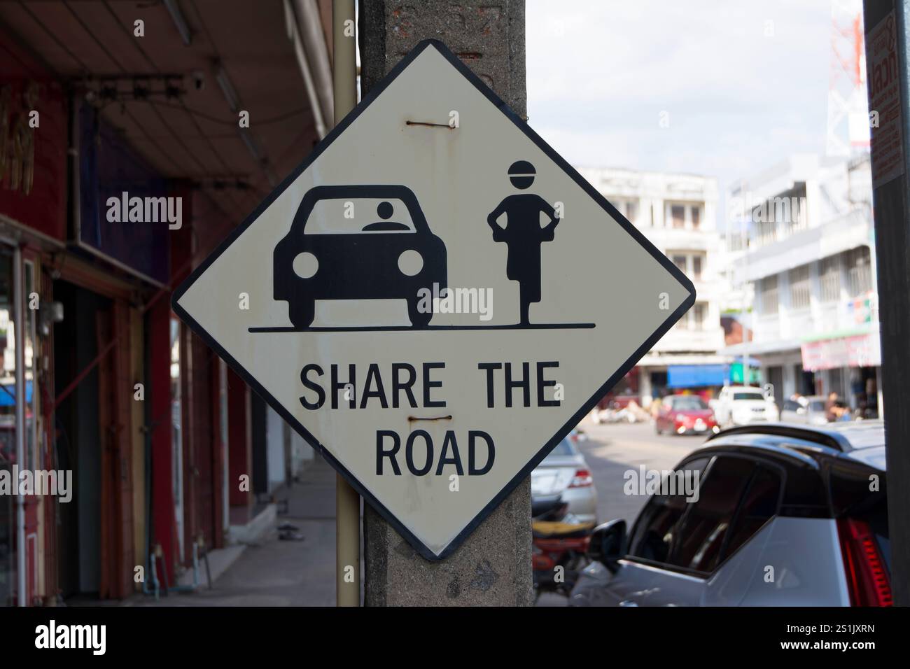 share the road sign in phetchabun, thailand, encouraging four- and two ...