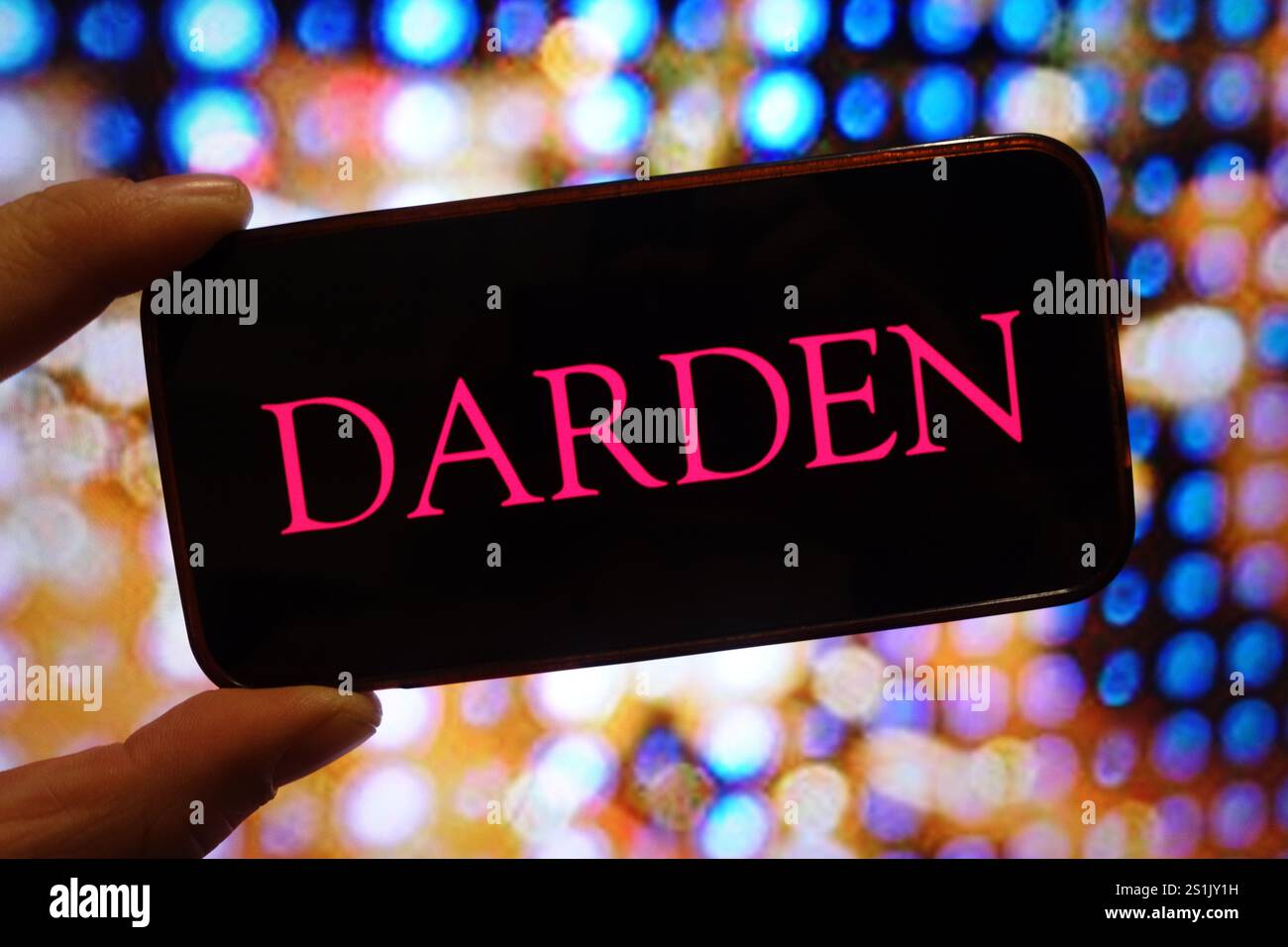 In this photo illustration, the Darden Restaurants company logo is seen ...