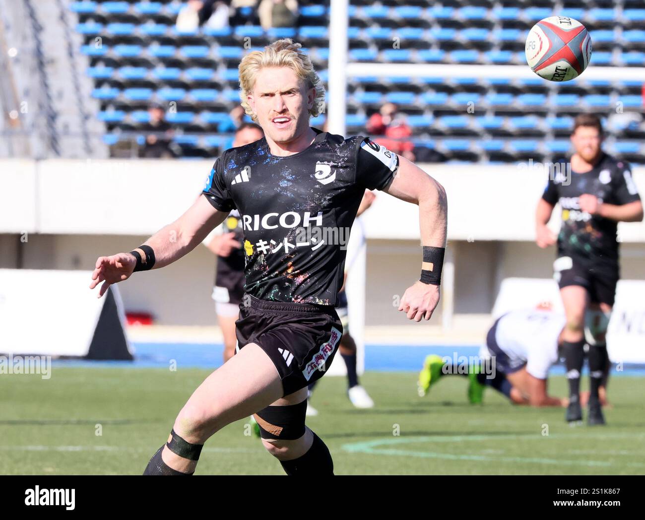 January 4, 2025, Tokyo, Japan - Ricoh BlackRams Tokyo full back Isaac Lucas follows the ball ...